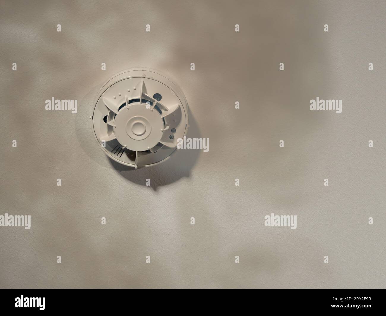 The smoke detector is installed on the ceiling and smoke rises ...