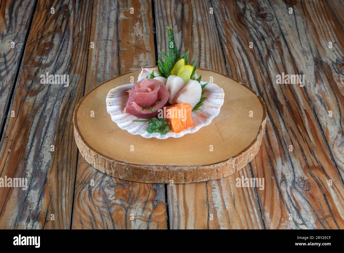 Traditional Japanese sashimi dish with assortment of raw fish served in ...