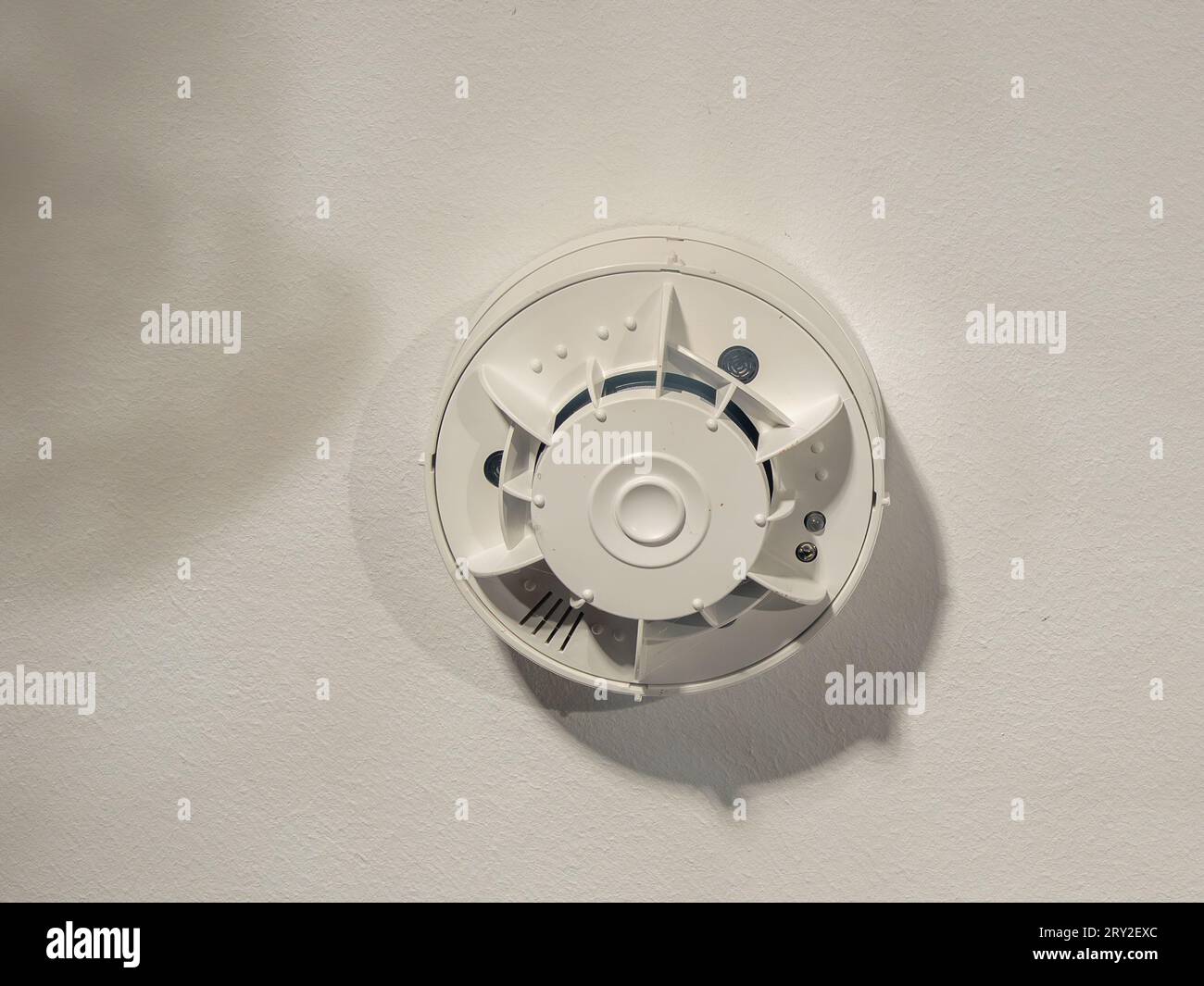 The smoke detector is installed on the ceiling and smoke rises ...