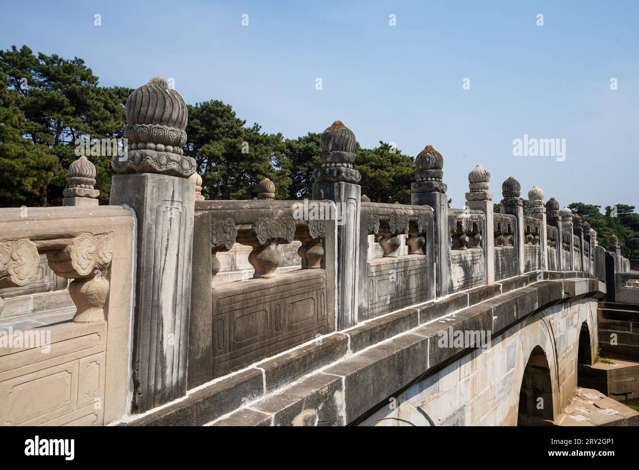 The stone bridge railing and column heads are located in the Eastern ...