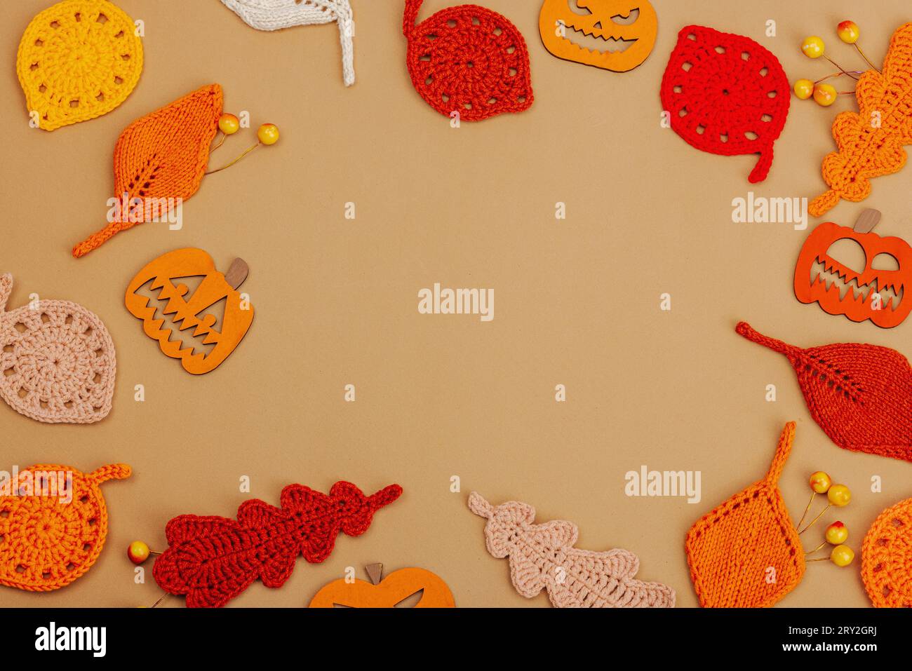 Handmade autumn background. Set of different fall knitted and crocheted ...