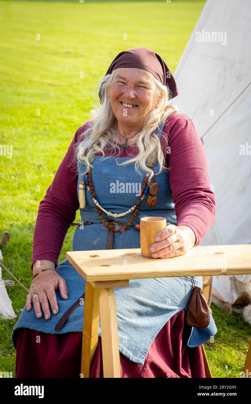 Viking woman drinking and laughing whilst celebrating 1100 years of the ...
