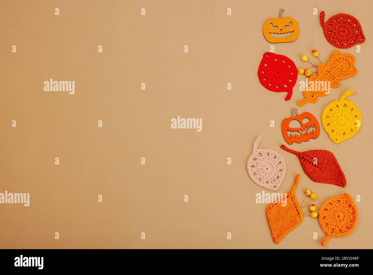 Handmade autumn background. Set of different fall knitted and crocheted ...