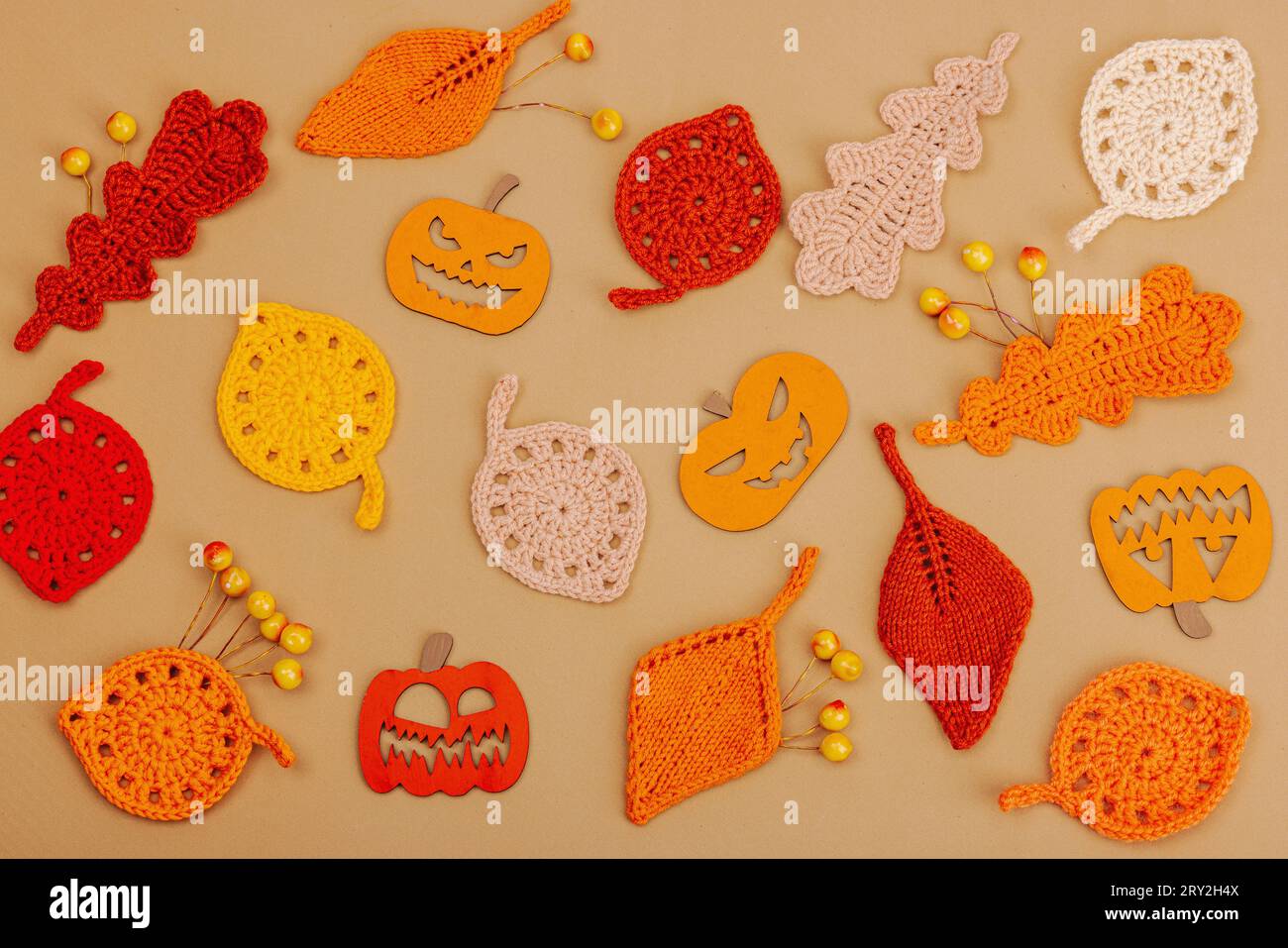 Handmade autumn background. Set of different fall knitted and crocheted ...