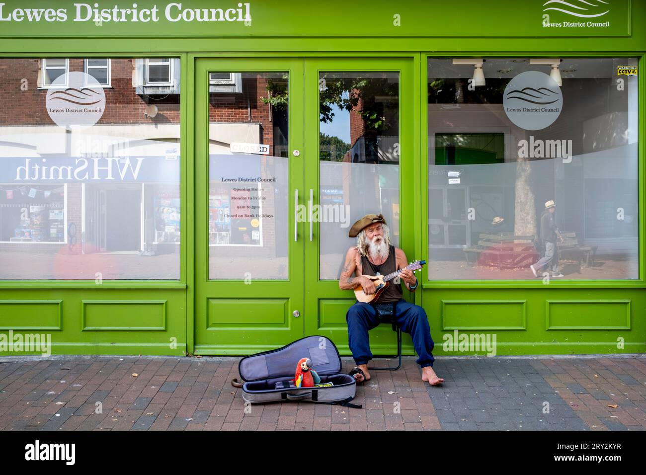 A Street Entertainer Dressed As A Pirate With A Toy Parrot Performing ...