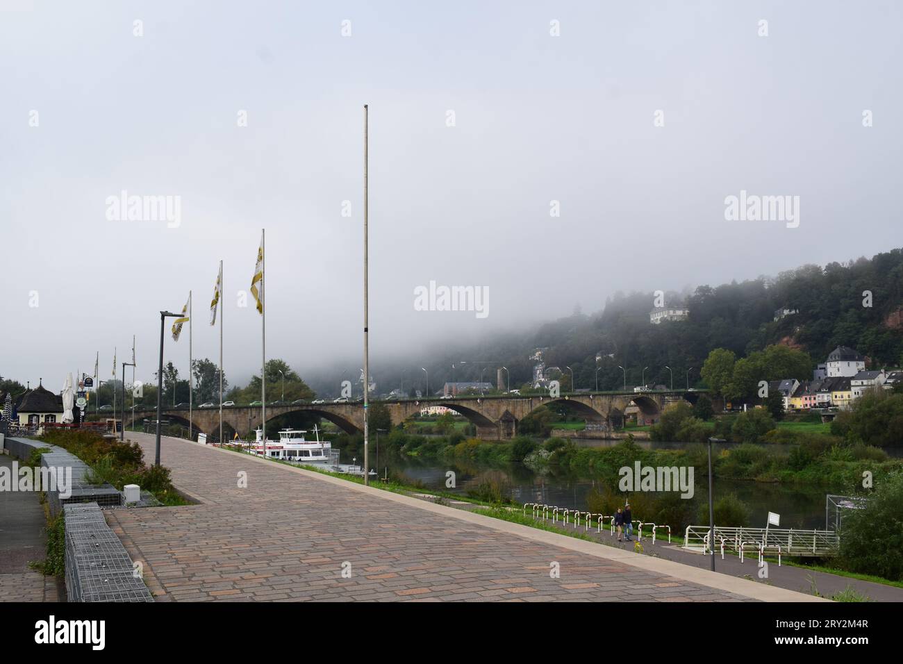 ancient Mosel bridge in morning fog, Römerbrücke in Trier Stock Photo ...