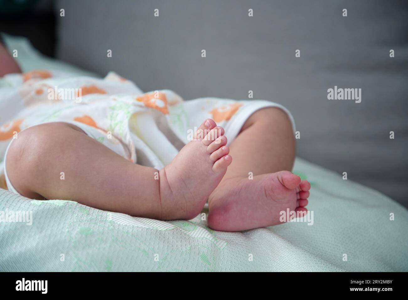 Fat calves and feet of infants Stock Photo - Alamy