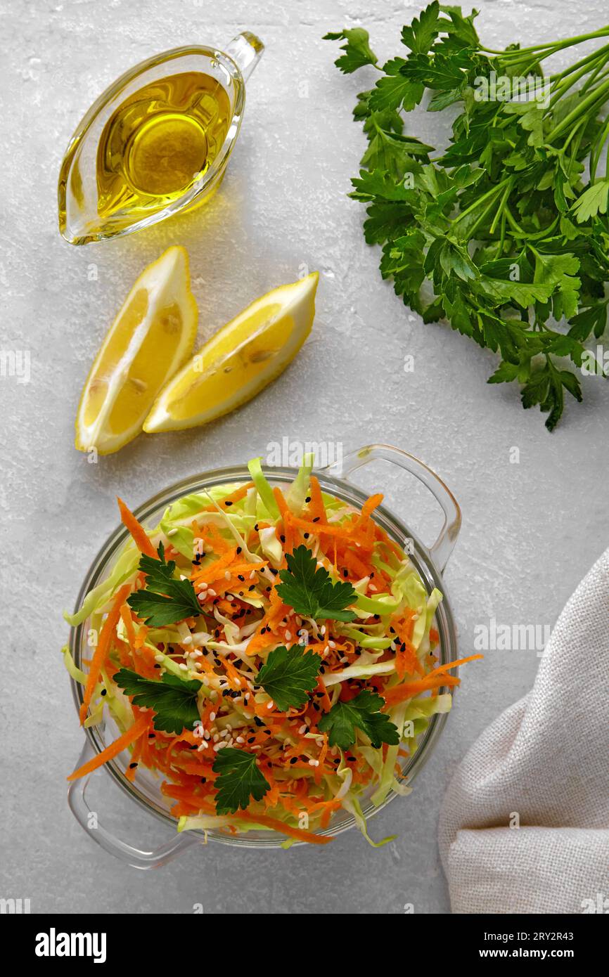 Summer light vegetable salad of white cabbage and carrots, decorated ...