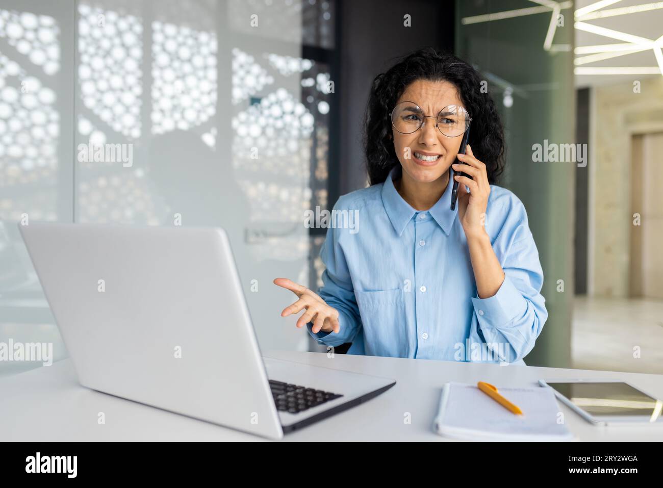 Upset and angry female boss at workplace inside office, frustrated ...