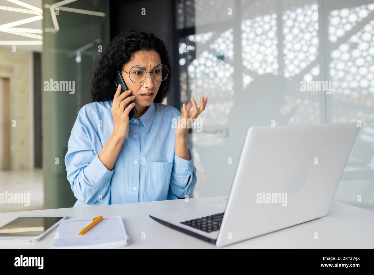 Upset and angry female boss at workplace inside office, frustrated ...