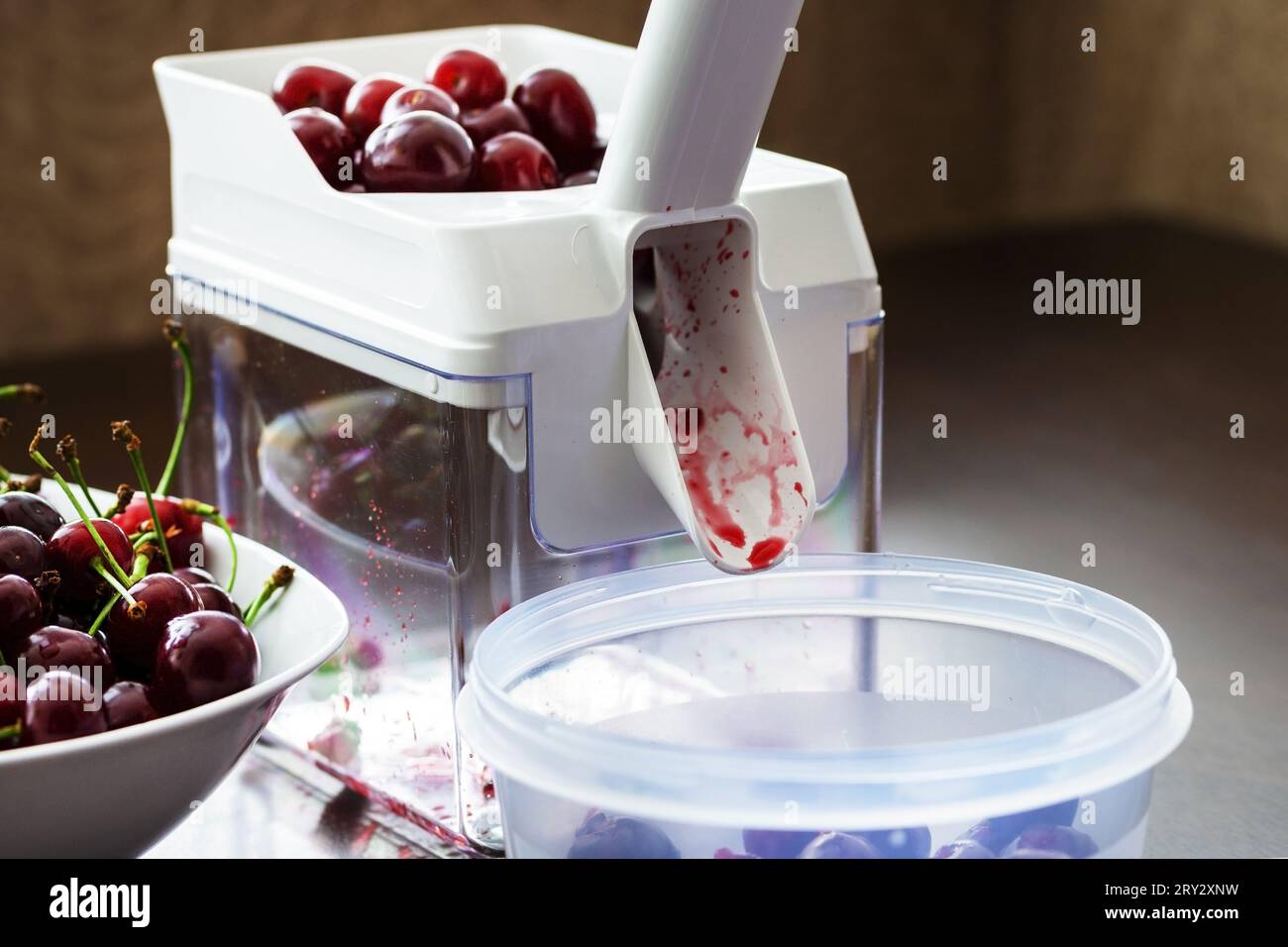 Removal of a stone from cherry. The plastic tool for processing of ...