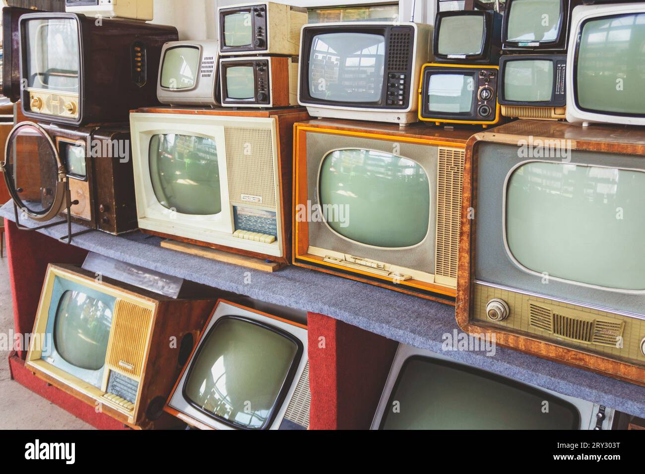 Many retro television. vintage old TV is colorful multi-row. Seeing the ...