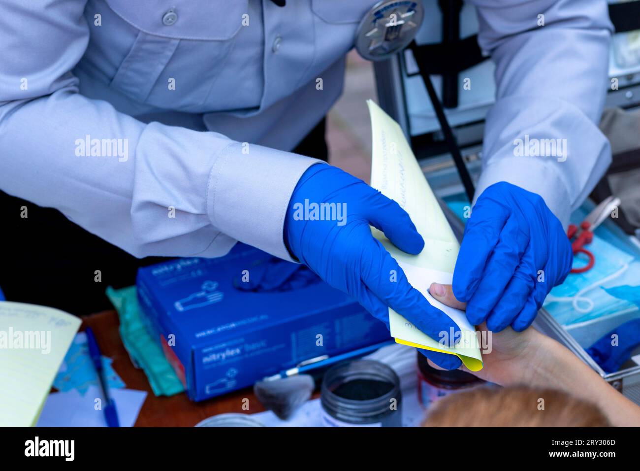 police expert takes fingerprints. Male fingerprint is taken. Concept ...