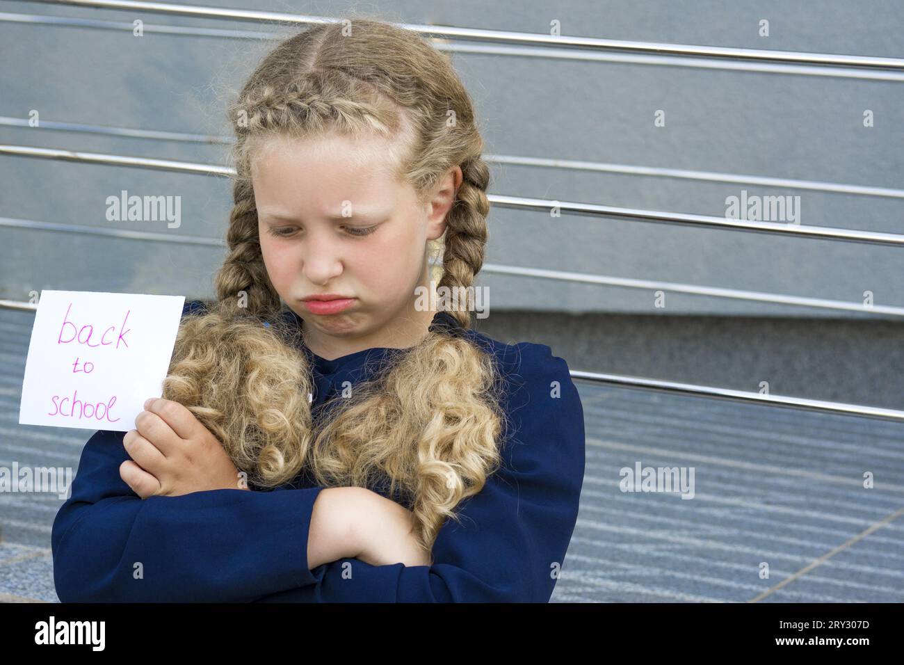 unhappy girl holding paper with the words . Concept School holidays ...