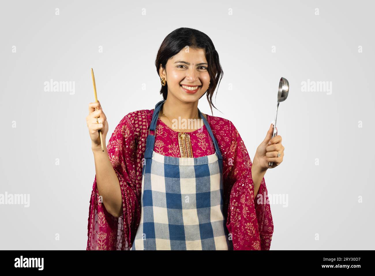 Beautiful Nepalese Indian Housewife in Kurthi, Apron with Kitchen ...