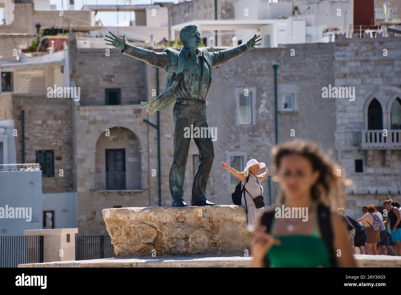 View of the Domenico Modugno bronze statue in Polignano a mare Stock ...
