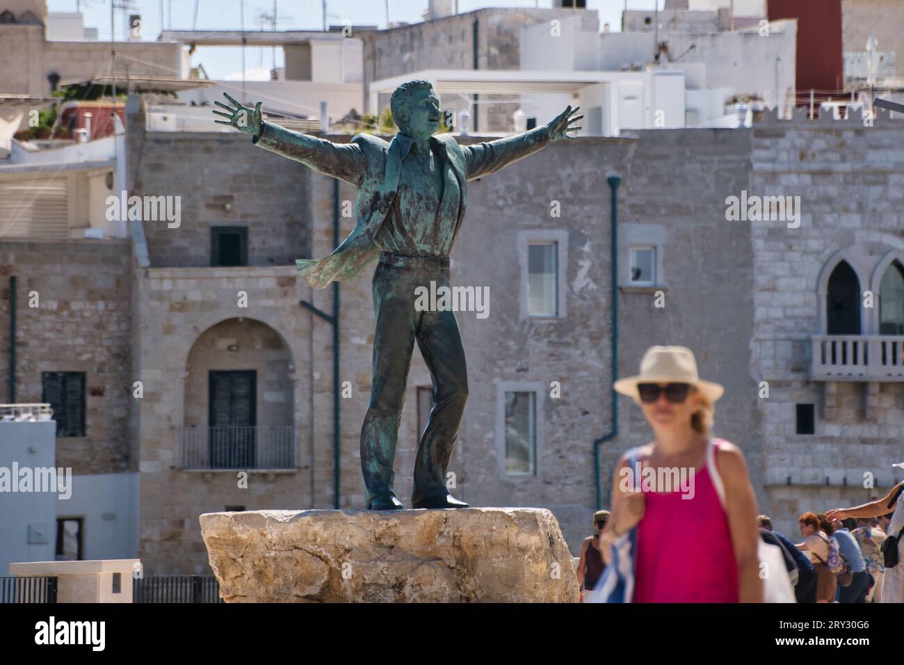 View of the Domenico Modugno bronze statue in Polignano a mare Stock ...