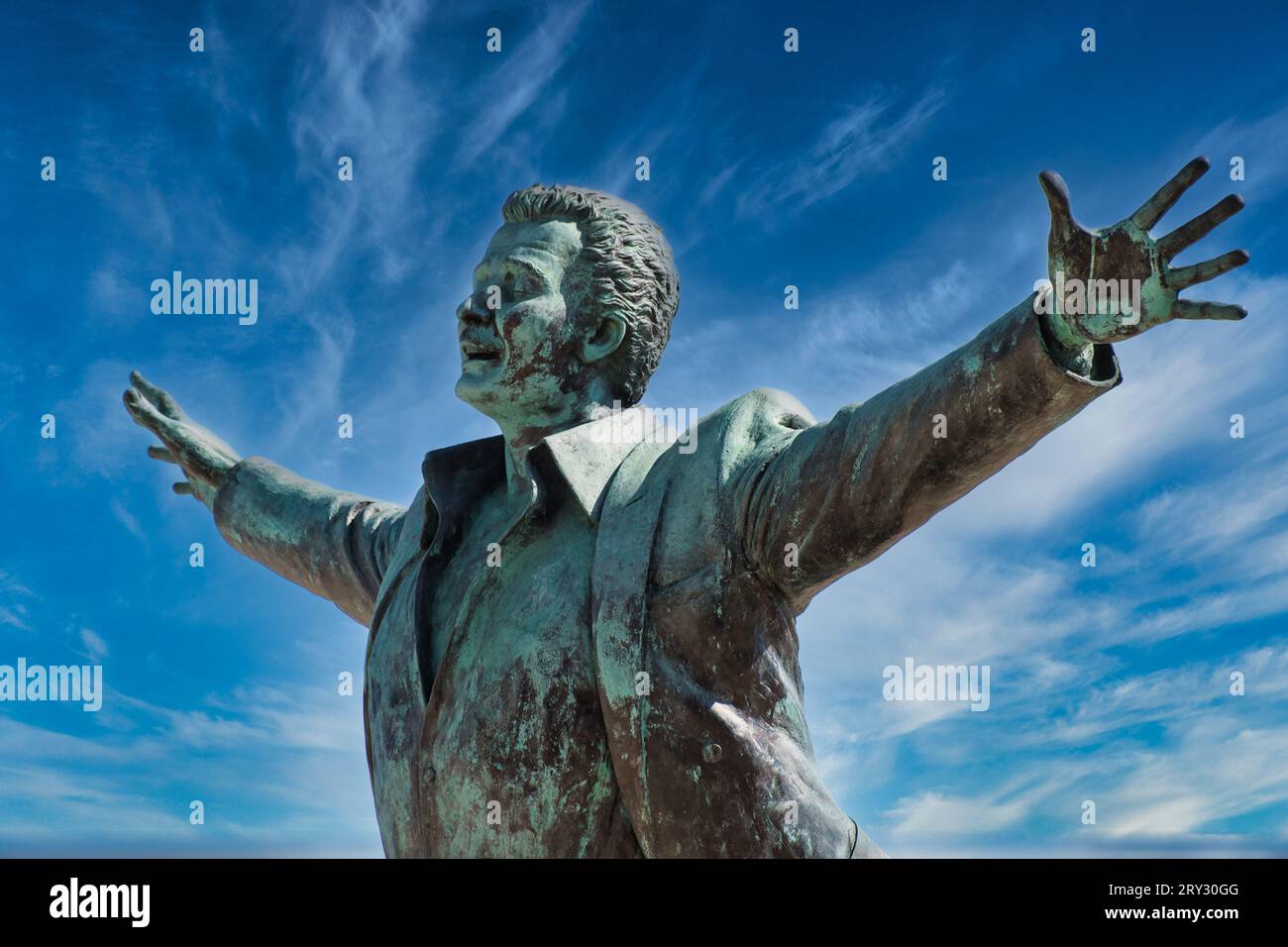 View of the Domenico Modugno bronze statue in Polignano a mare Stock ...