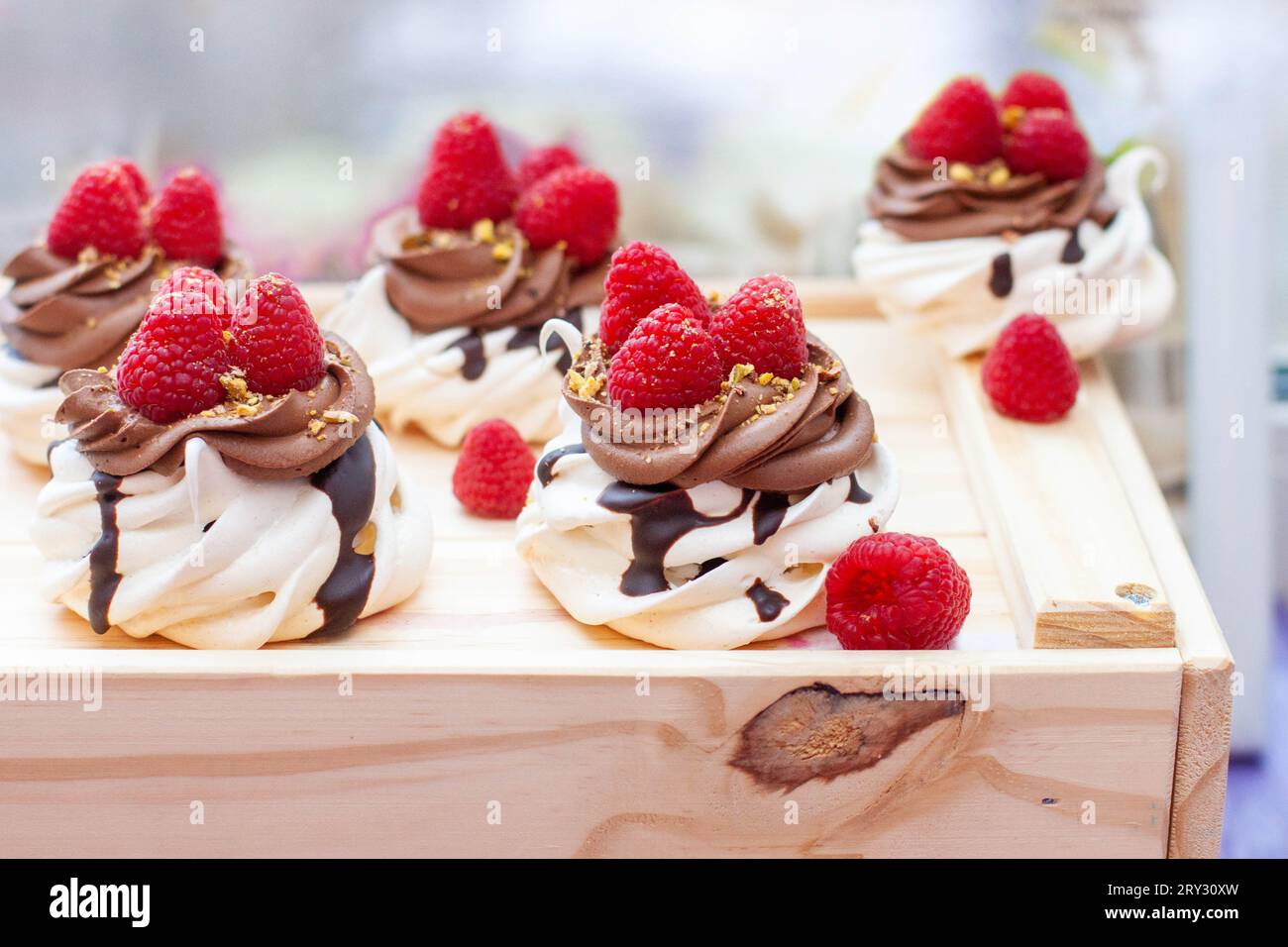 Mini cakes with whipped cream, chocolate, meringue and fresh ...