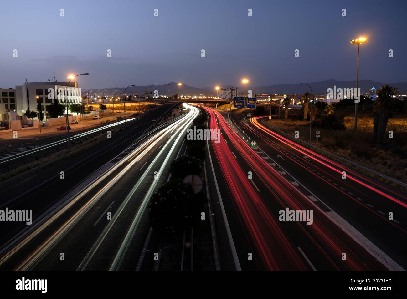 Night photo Entry and exit of cars from the city Red and white lights ...