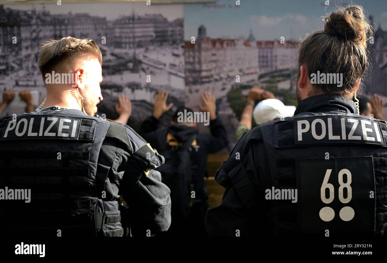 28 September 2023, Hesse, Frankfurt/Main: Police officers stand in ...