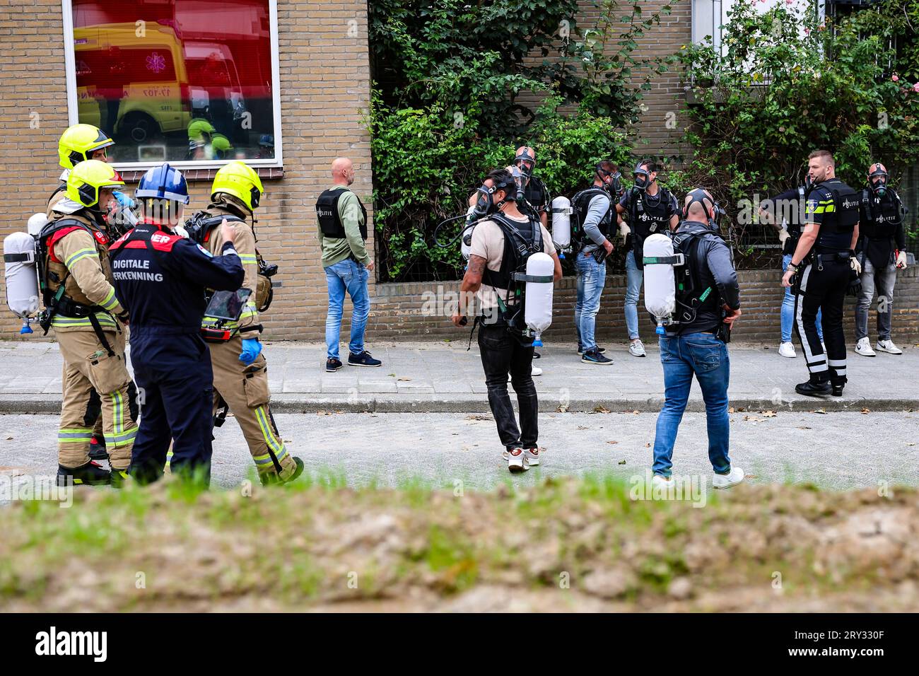 ROTTERDAM - Special units of the police and fire brigade at a fire in a ...