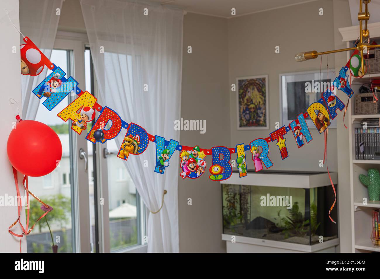 Interior view of room decorated with colorful Happy Birthday letters ...