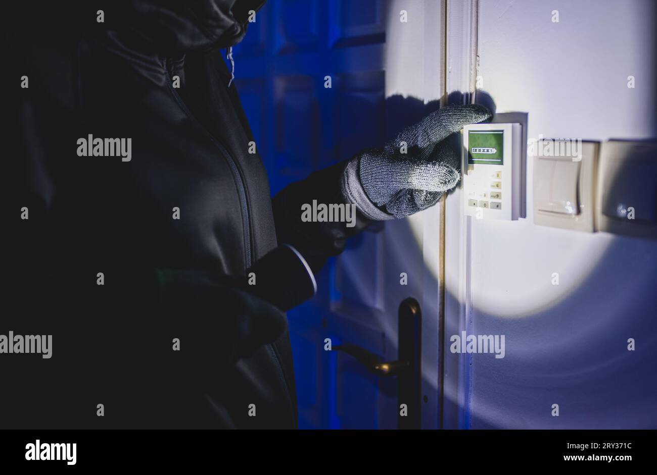 Female thief breaks into the apartment through the front door Stock ...