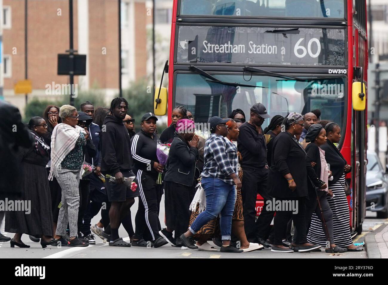 Family and friends of Elianne Andam at the scene in Croydon, south ...