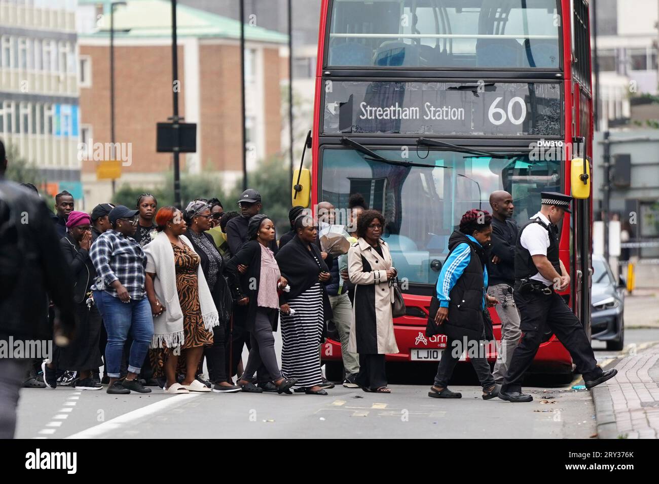 Family and friends of Elianne Andam at the scene in Croydon, south ...