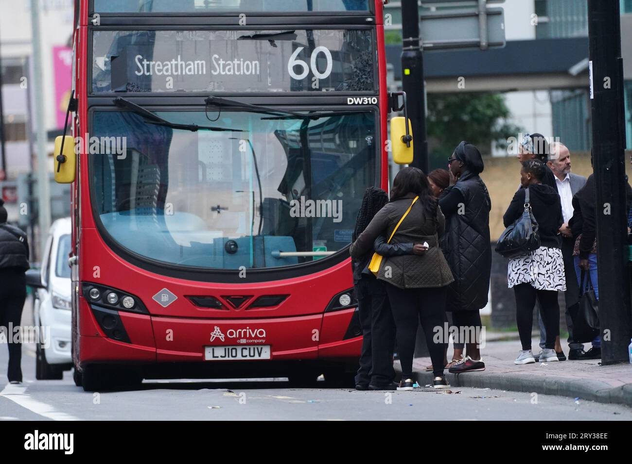 Family and friends of Elianne Andam at the scene in Croydon, south ...
