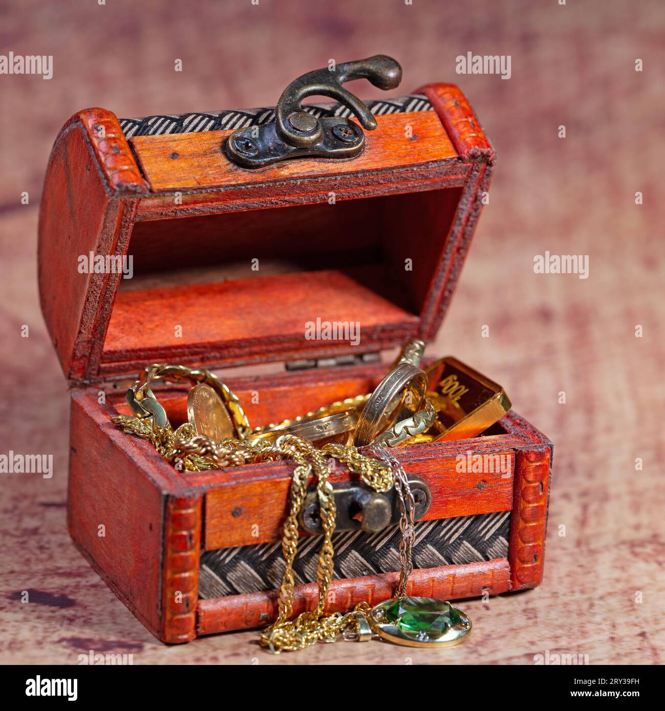 Gold jewelry and gold coins in the wooden casket Stock Photo - Alamy