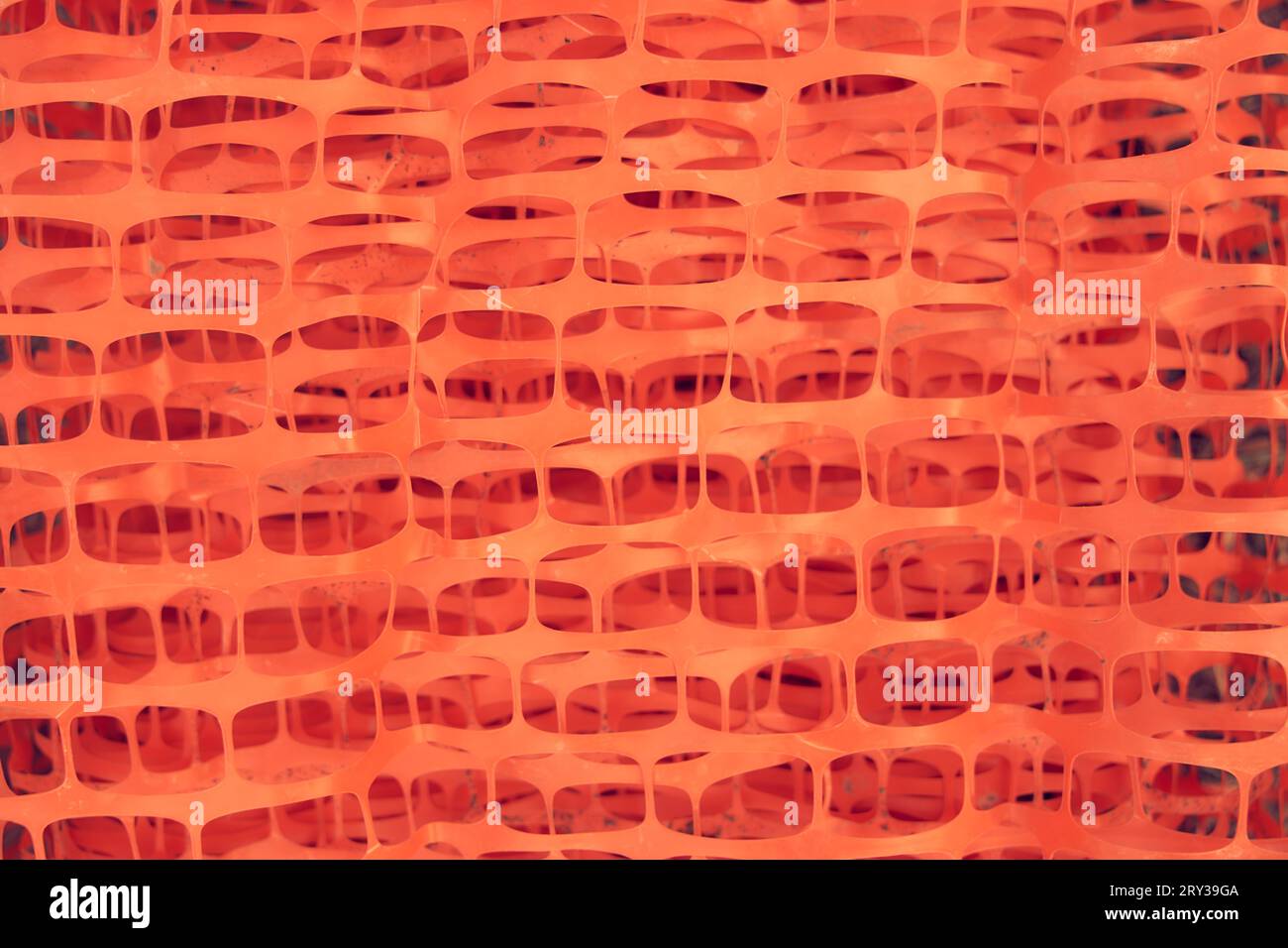 Reinforcing mesh for plaster. Orange construction mesh in rolls in a ...