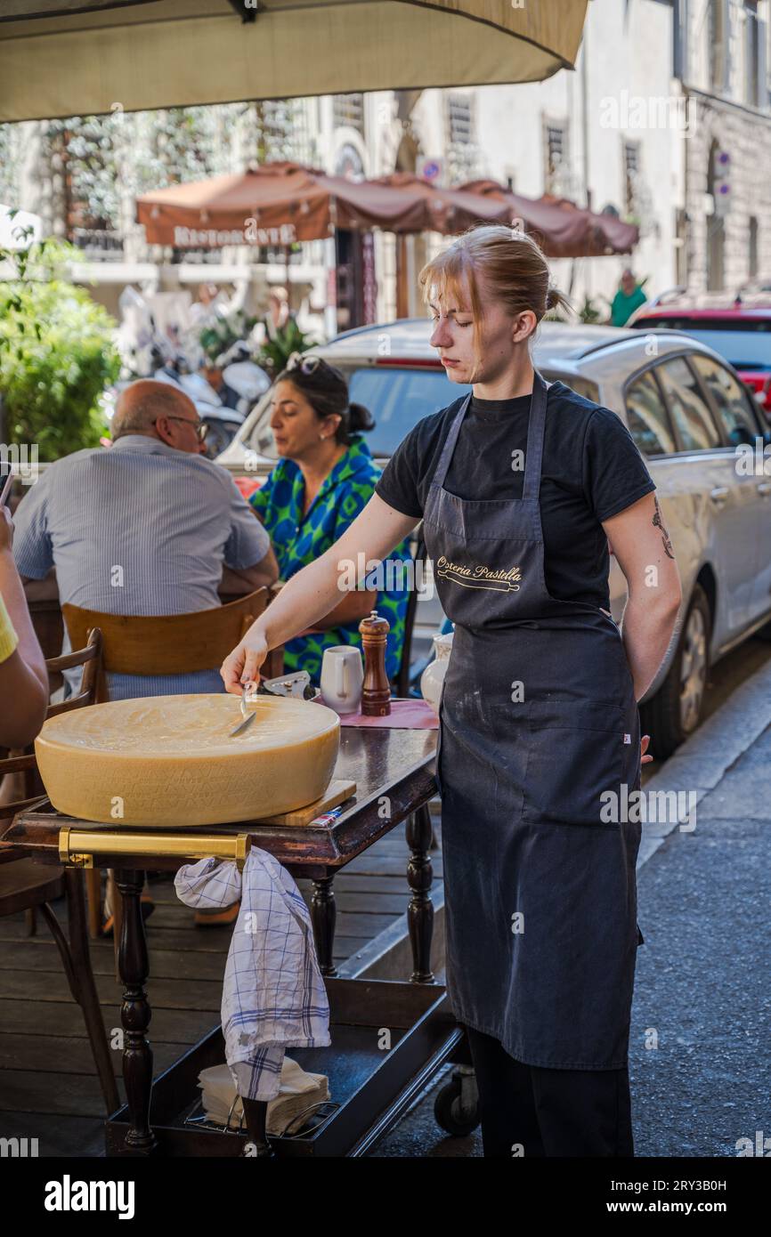 Florence, Italy — Sept11, 2023. A vertical shot of a chef cooking a ...