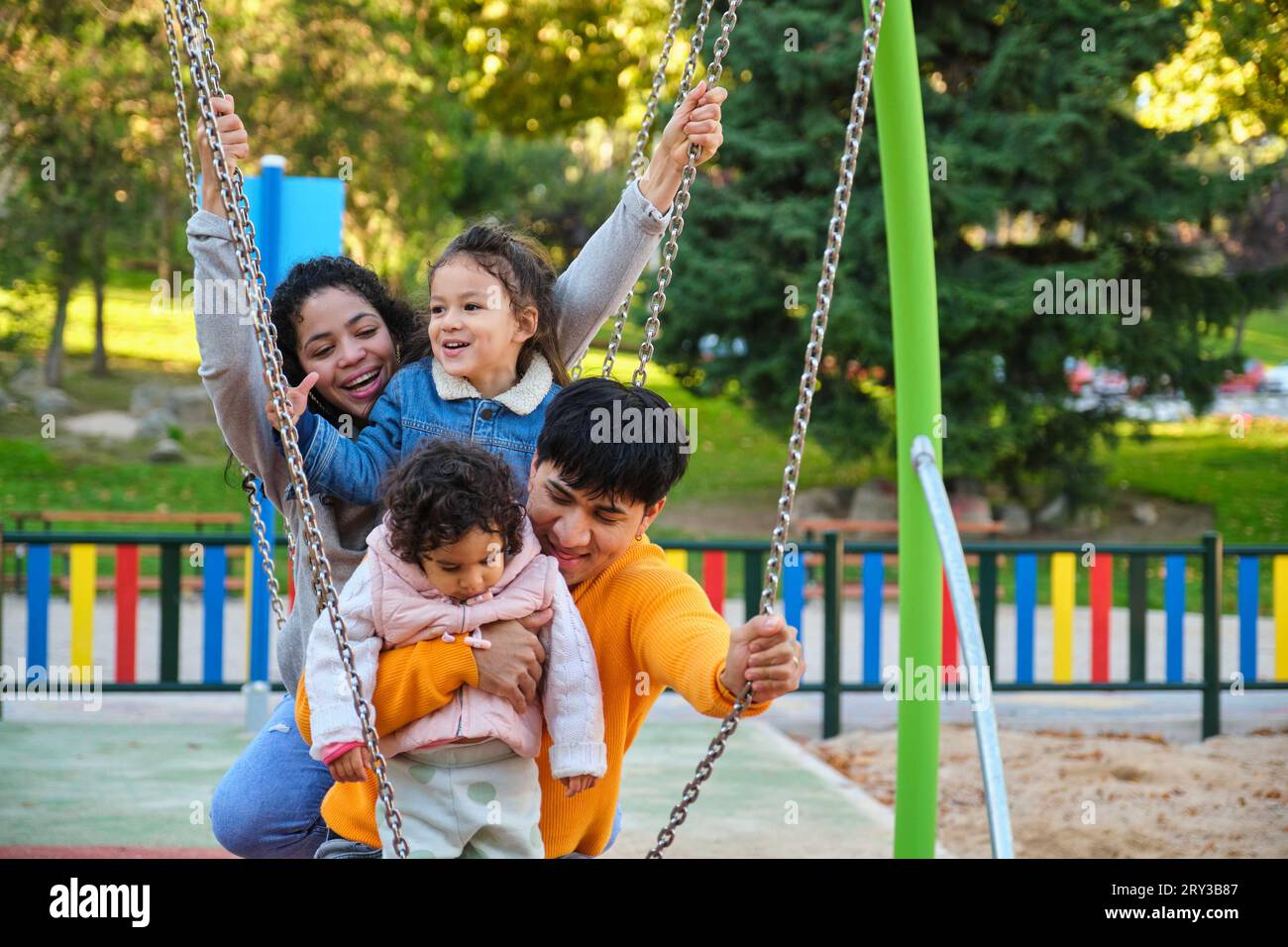 Latin children playing park playground hi-res stock photography and ...