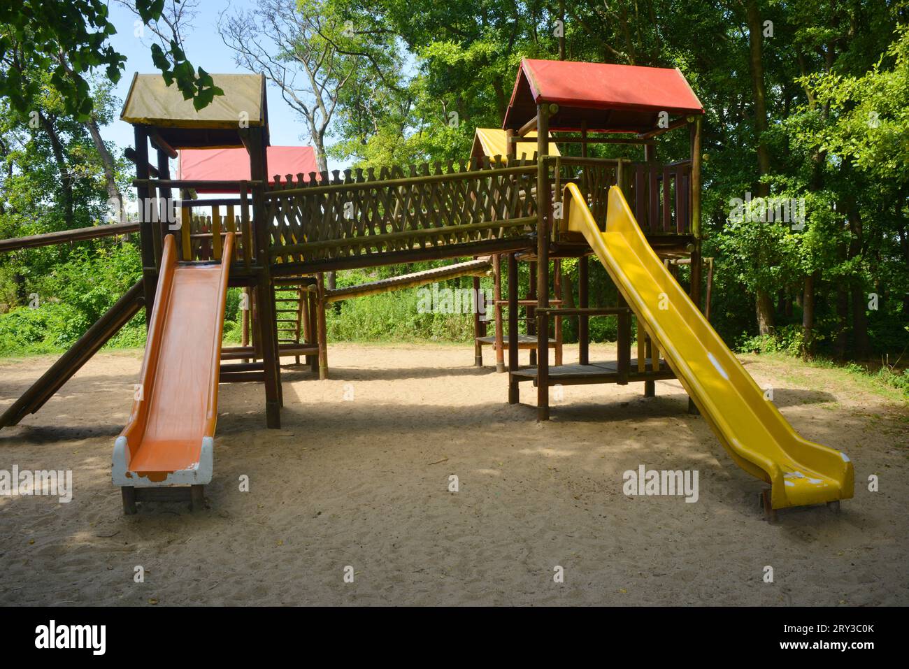 Playground with double slides for children and climbing facilities ...