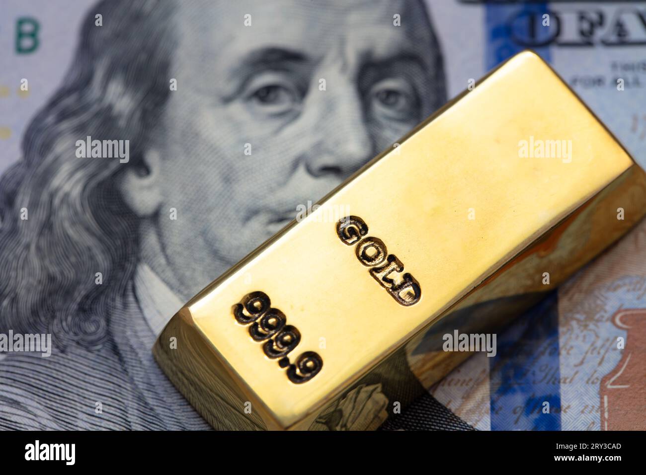gold bar on US 100 dollar banknote background for design purpose Stock ...