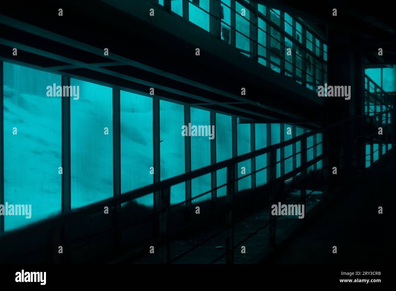 Blue tunnel. Blue color of glass in pedestrian crossing. Dark ...