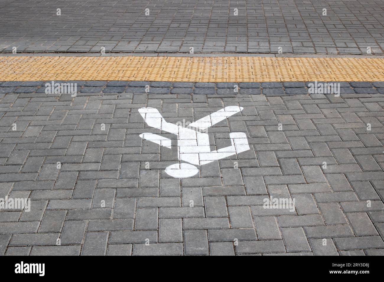 Symbol of the footpath on the sidewalk close up Stock Photo - Alamy