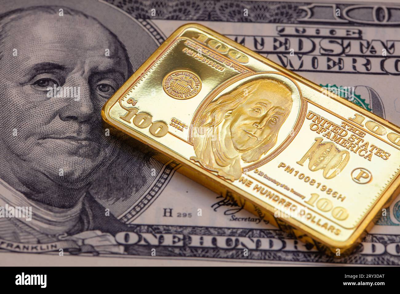 US 100 dollar golden bar die cut stamp on US 100 dollar banknote ...