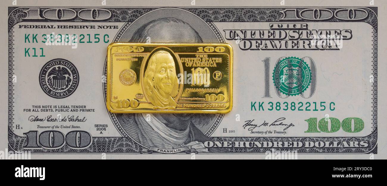 US 100 dollar golden bar die cut stamp on US 100 dollar banknote ...