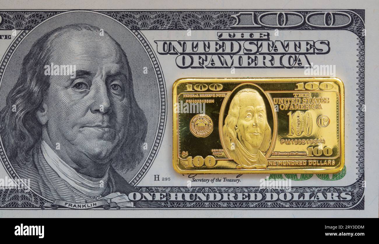 US 100 dollar golden bar die cut stamp on US 100 dollar banknote ...