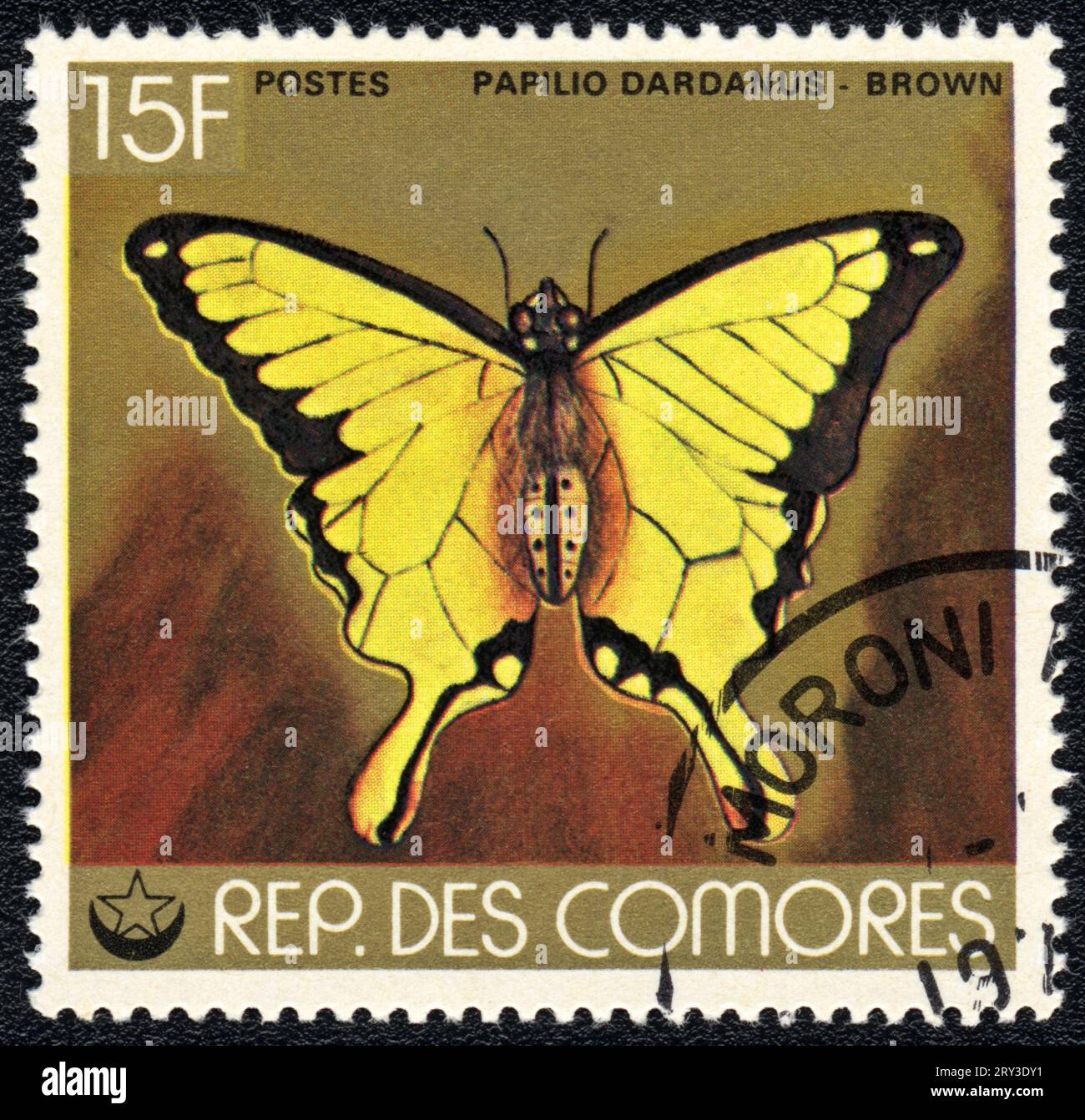 A stamp printed in REP.COMORES shows butterfly papilio dardanus ...