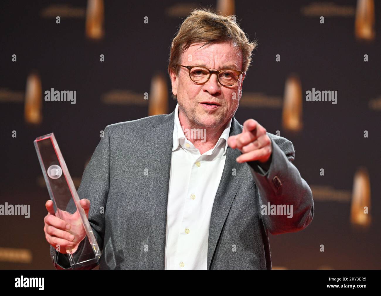 Cologne, Germany. 28th Sep, 2023. Sports reporter Béla Réthy celebrates ...