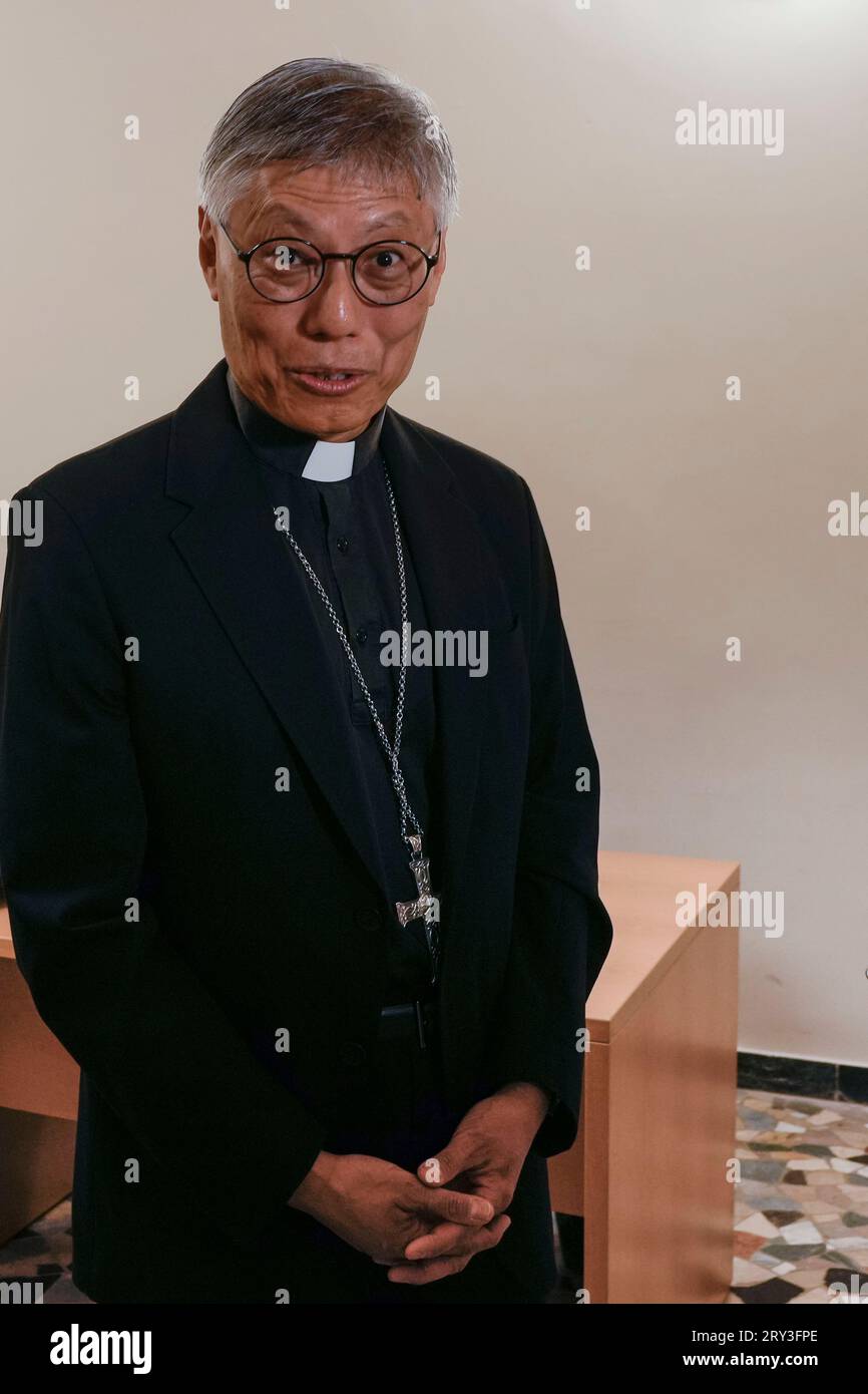 Cardinal-elect, Hong Kong Bishop Stephen Chow poses for photos during a ...