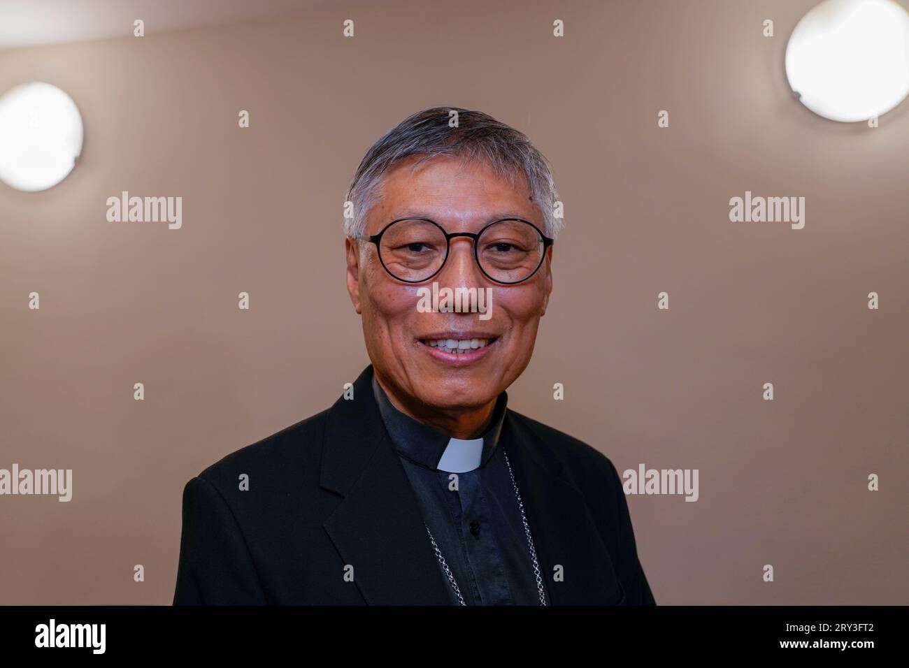 Cardinal-elect, Hong Kong Bishop Stephen Chow poses for photos during a ...