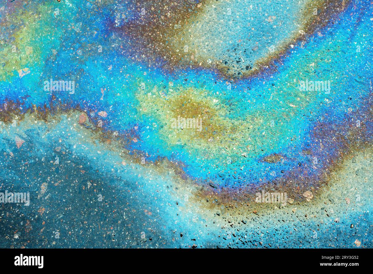 Colored oil stains close up, the color of the gasoline stain on the ...