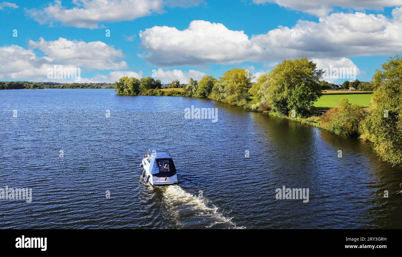 Idyllic dutch rural river landscape with sport motor boat - Oude Maas ...