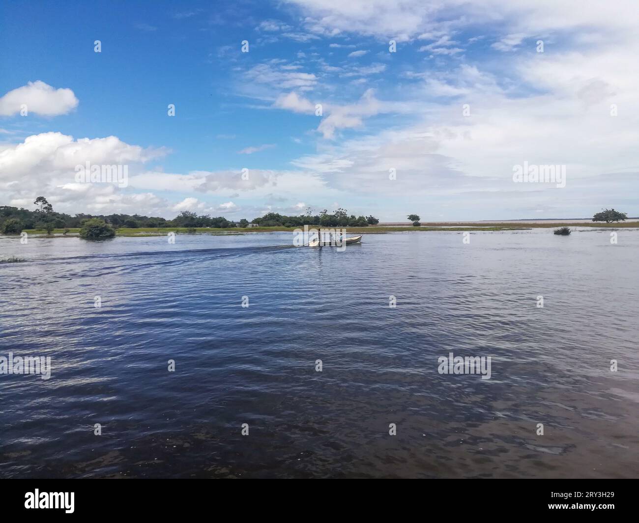 View to Amazon river and traditional boats in the Brazilian Rainforest ...