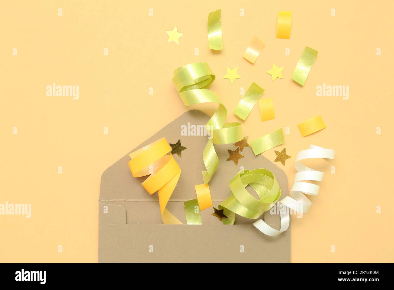 Composition with envelope and confetti on yellow background Stock Photo ...